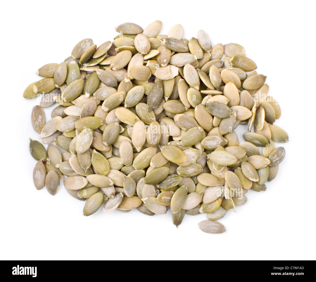 Heap of pumpkin seeds isolated on white background Stock Photo - Alamy