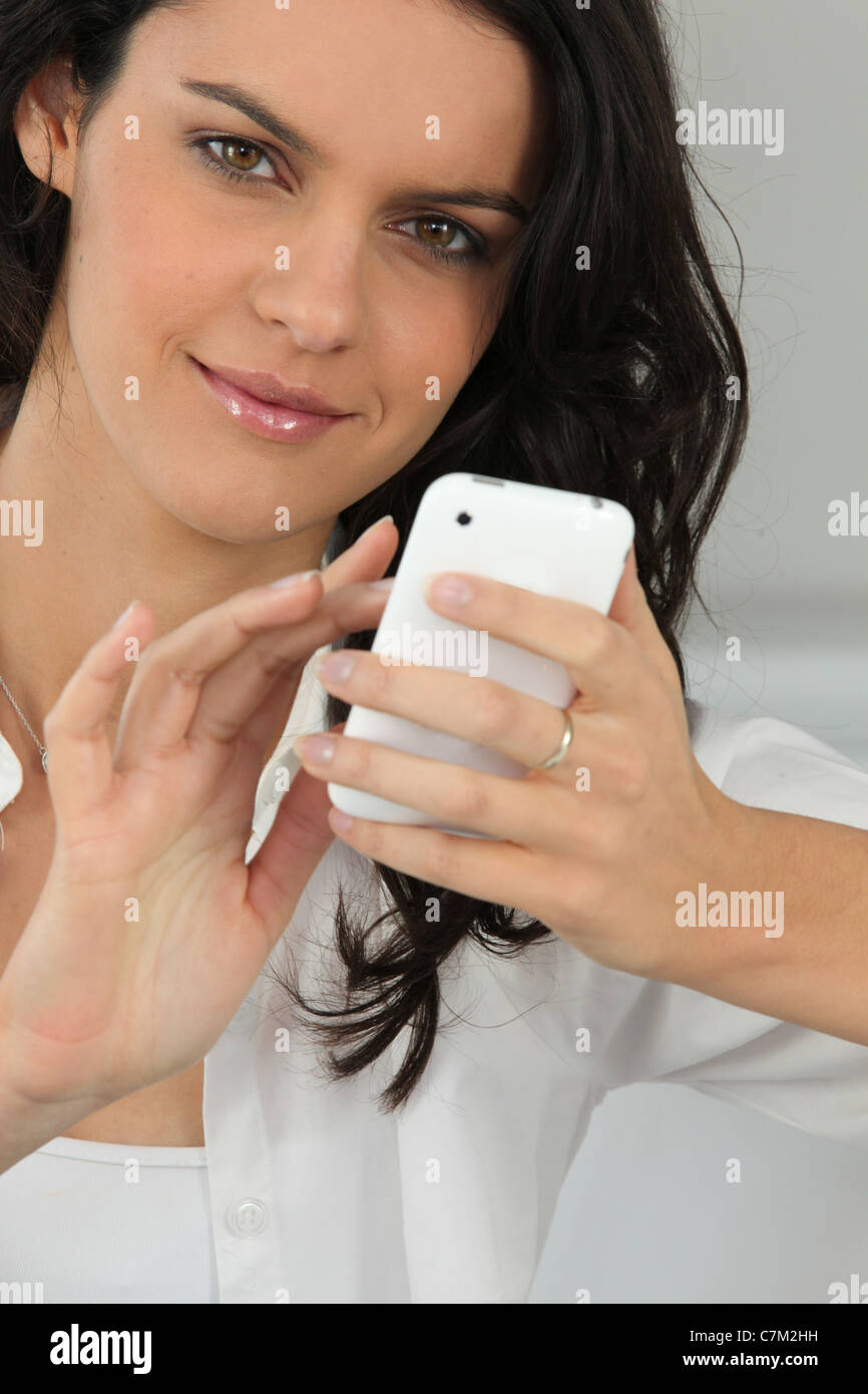 beautiful young woman writing messages on her cell phone Stock Photo ...