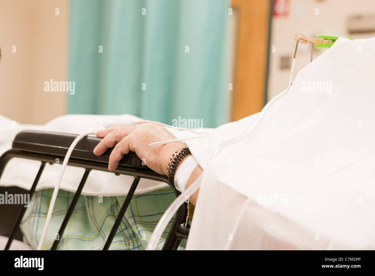 Patient's hand during surgery, and pulse oximeter to measure pulse and ...