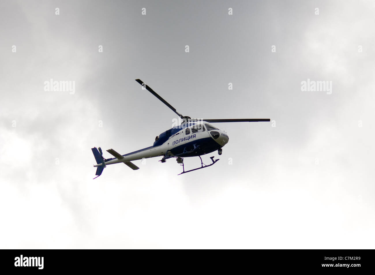 Police helicopter in the background of the cloudy sky Stock Photo - Alamy