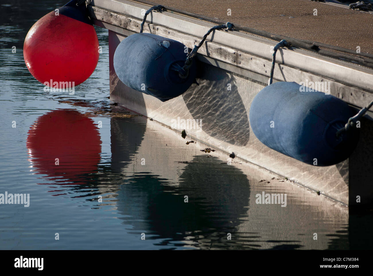 Fenders on side of marina pontoon Stock Photo - Alamy