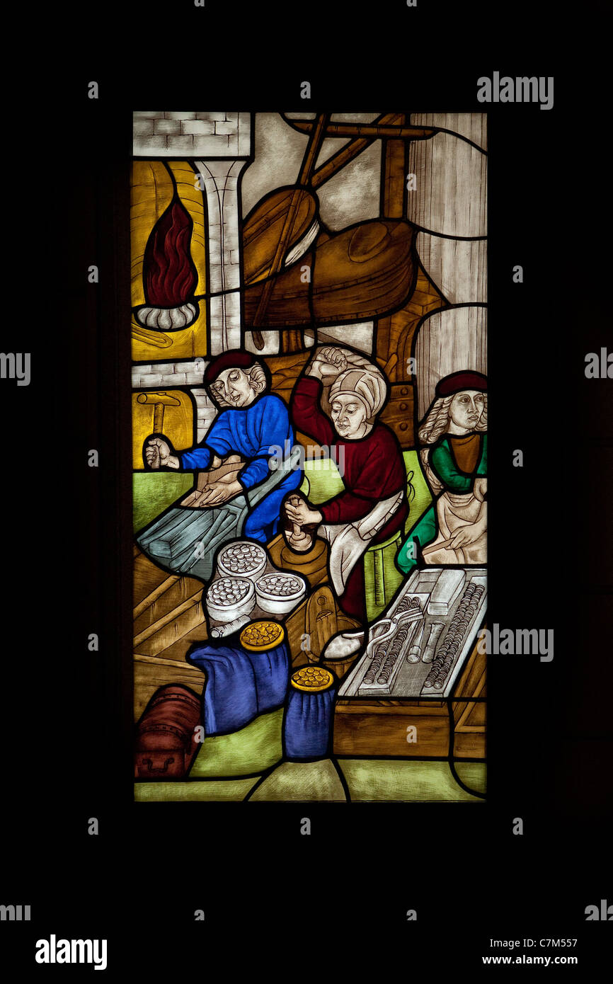 Stained Glass window depicting Money Making Stock Photo - Alamy