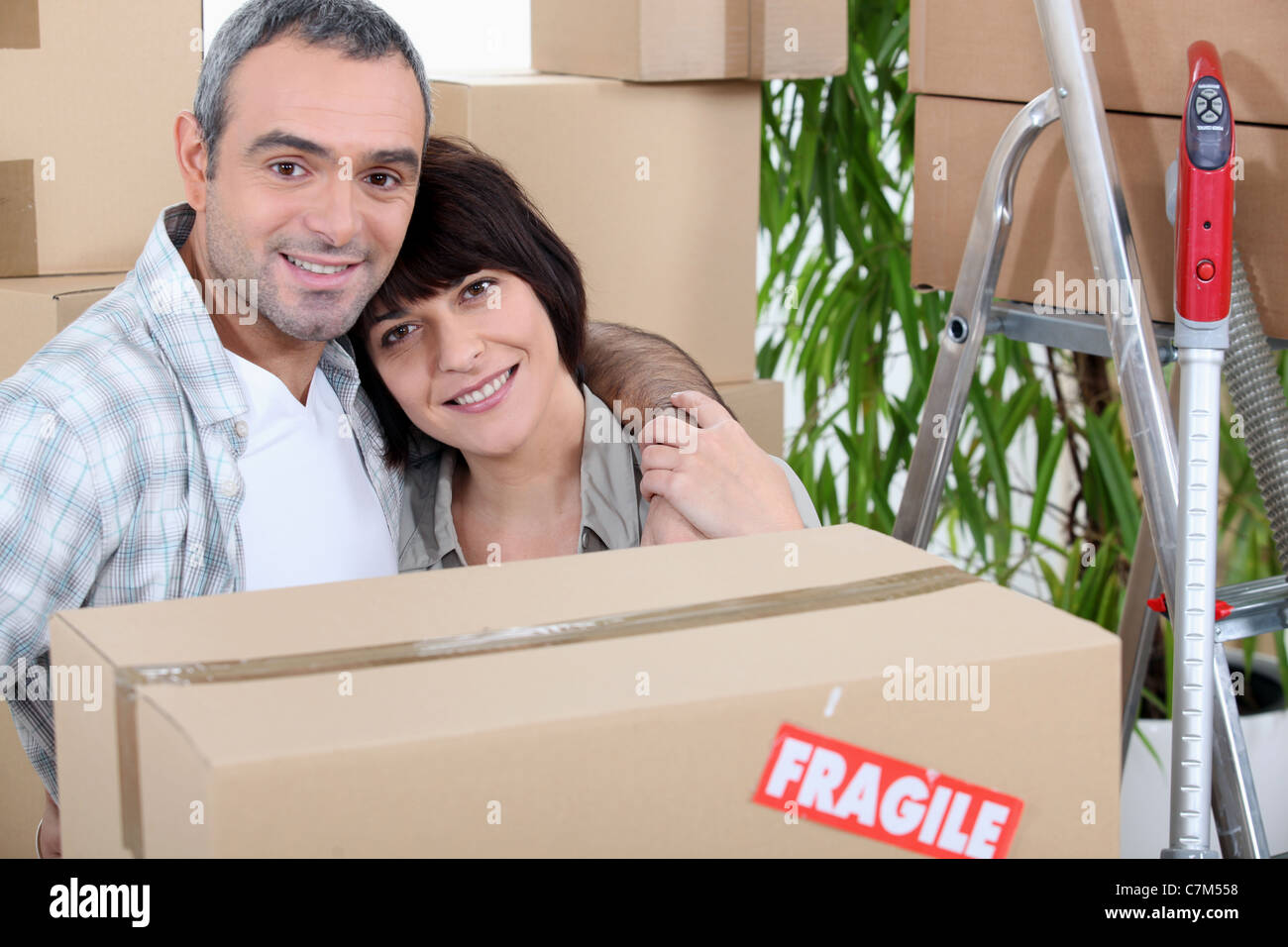 Couple moving home Stock Photo - Alamy