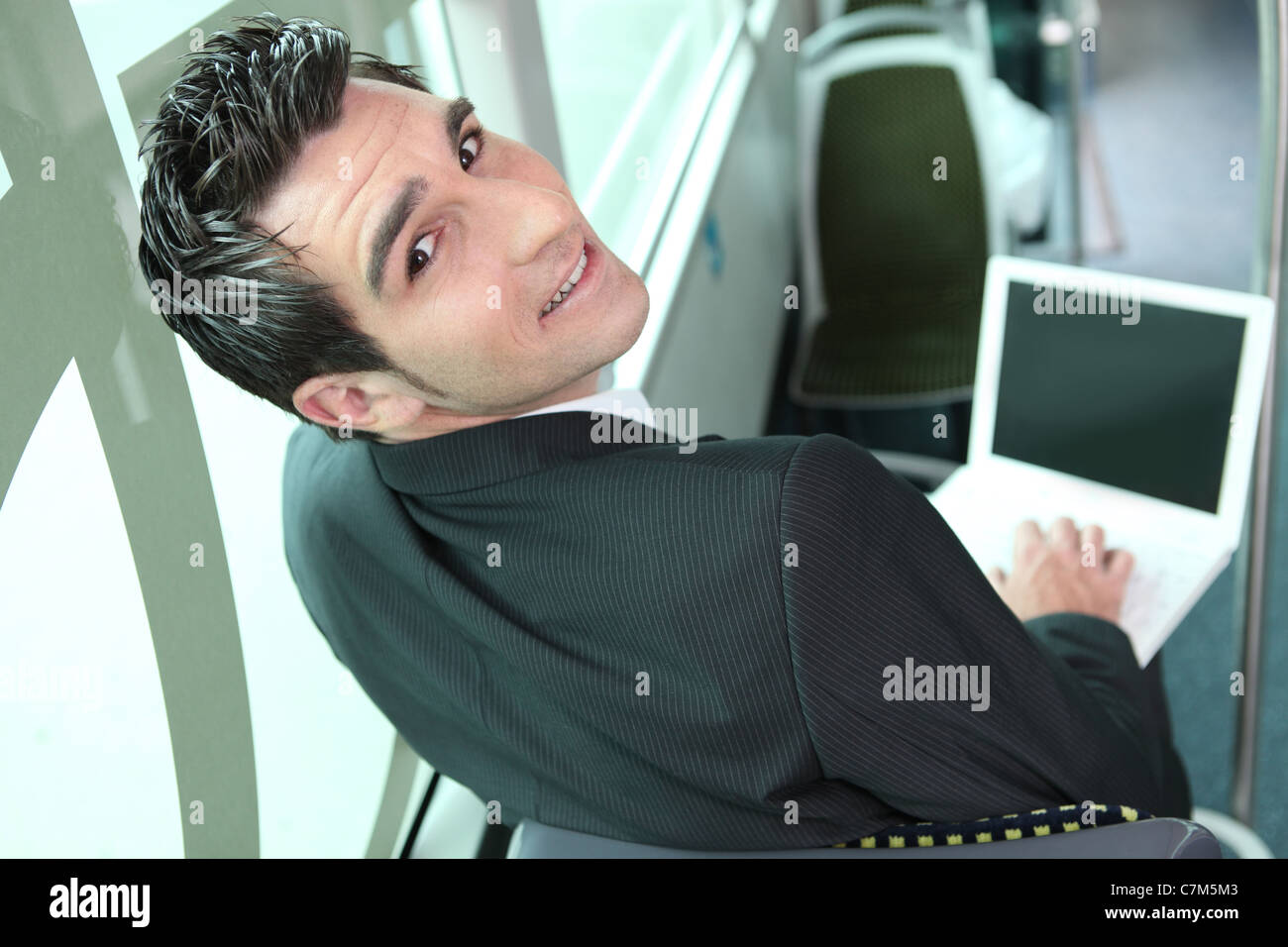 young man in public transportation Stock Photo - Alamy