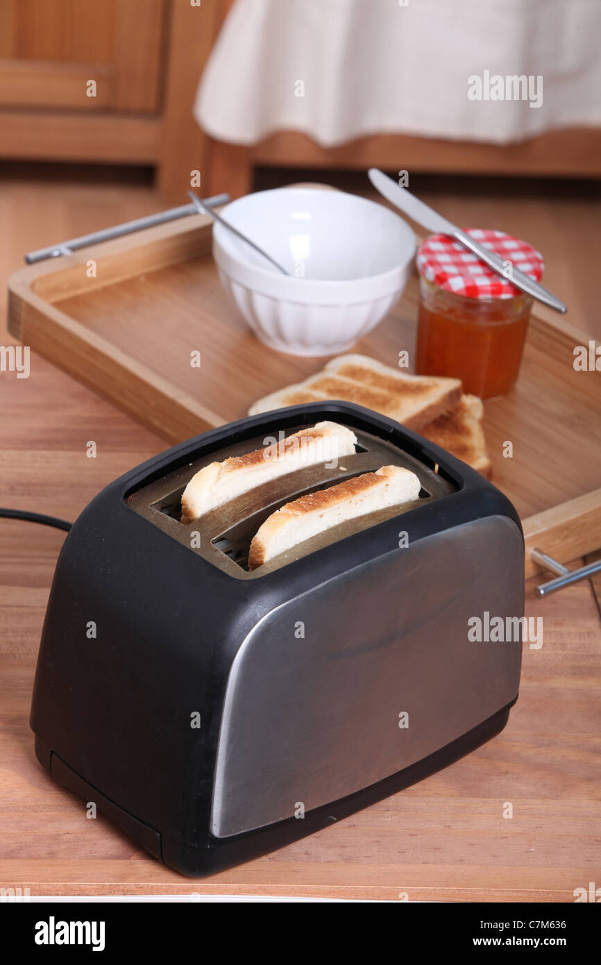 Toasting bread for breakfast Stock Photo - Alamy