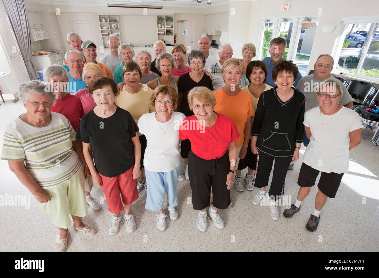 Group of people standing together after exercise class Stock Photo - Alamy