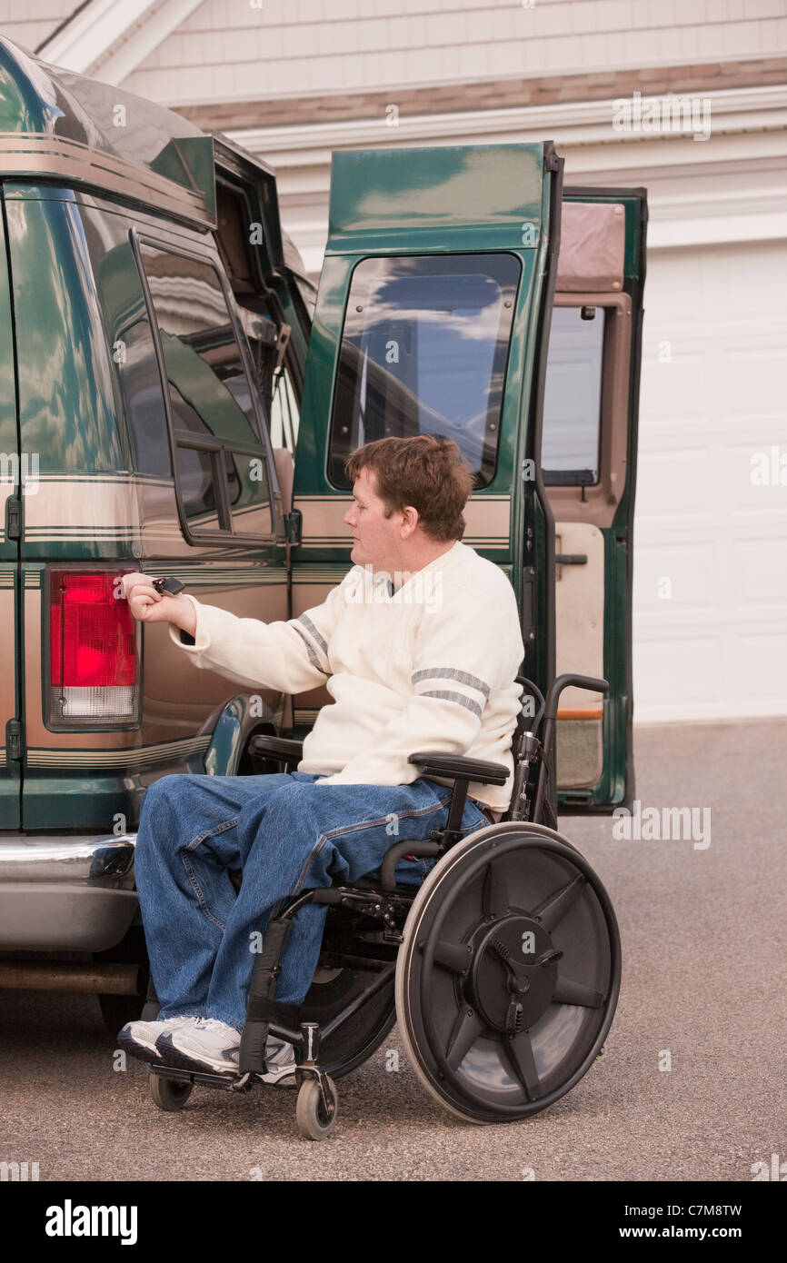 Man with spinal cord injury using magnetized remote to close his ...