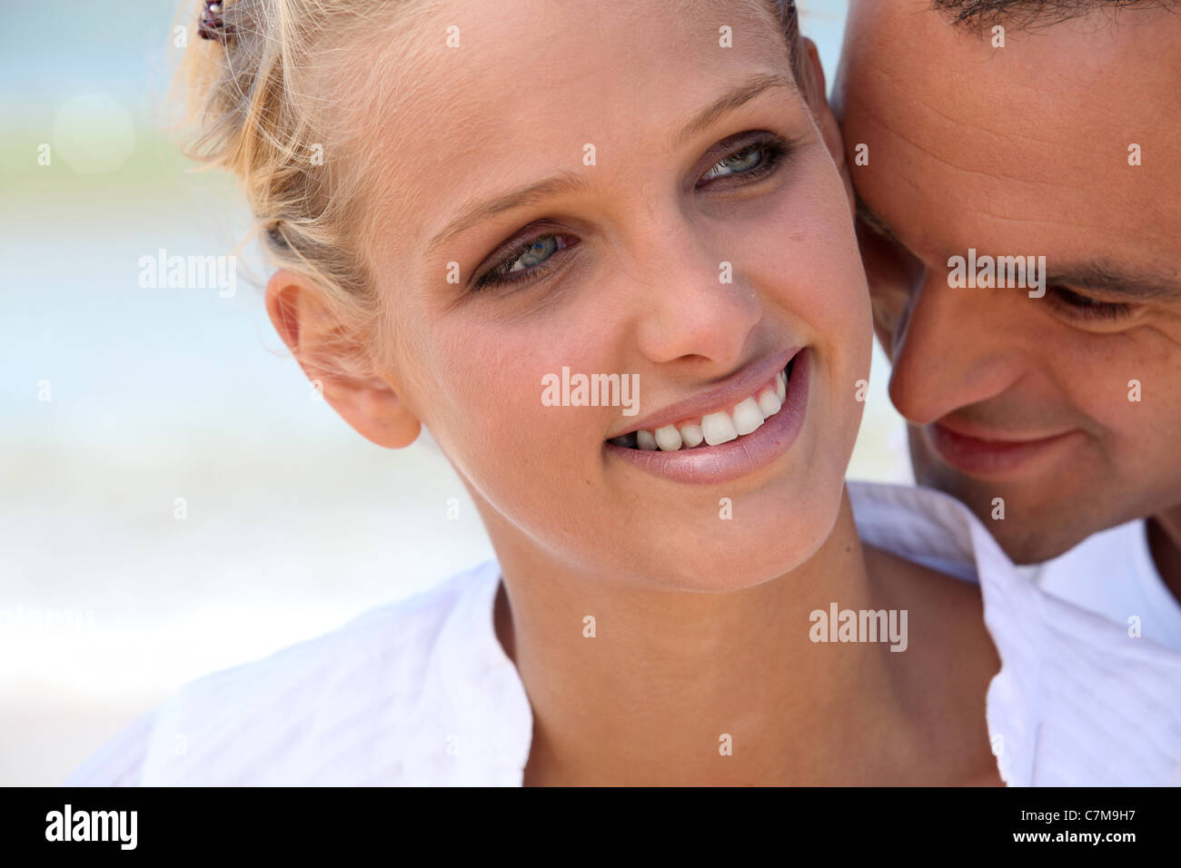 Man nuzzling his wife's neck Stock Photo - Alamy