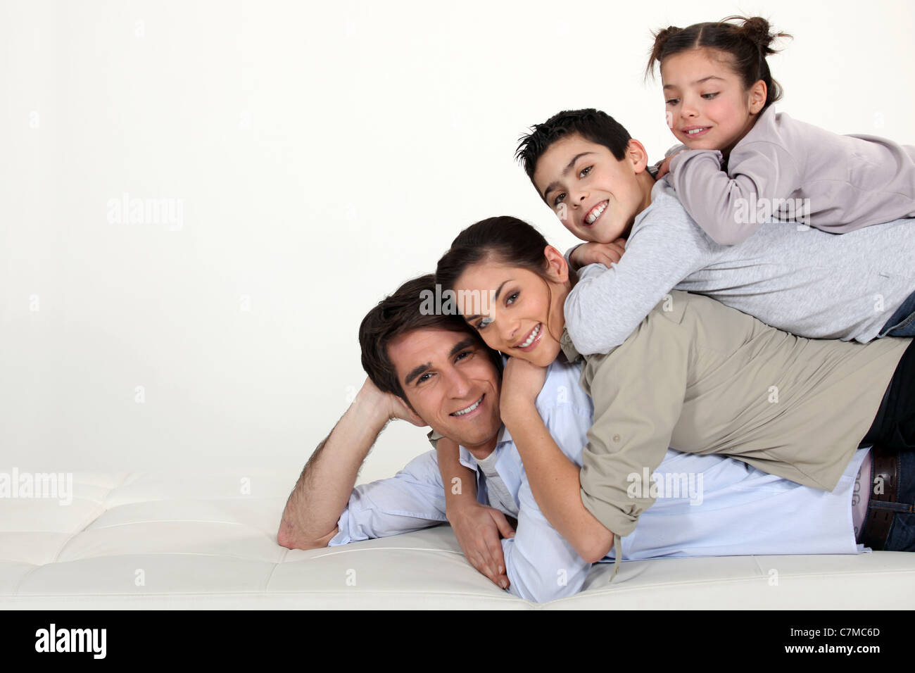 Studio portrait of a happy family Stock Photo - Alamy