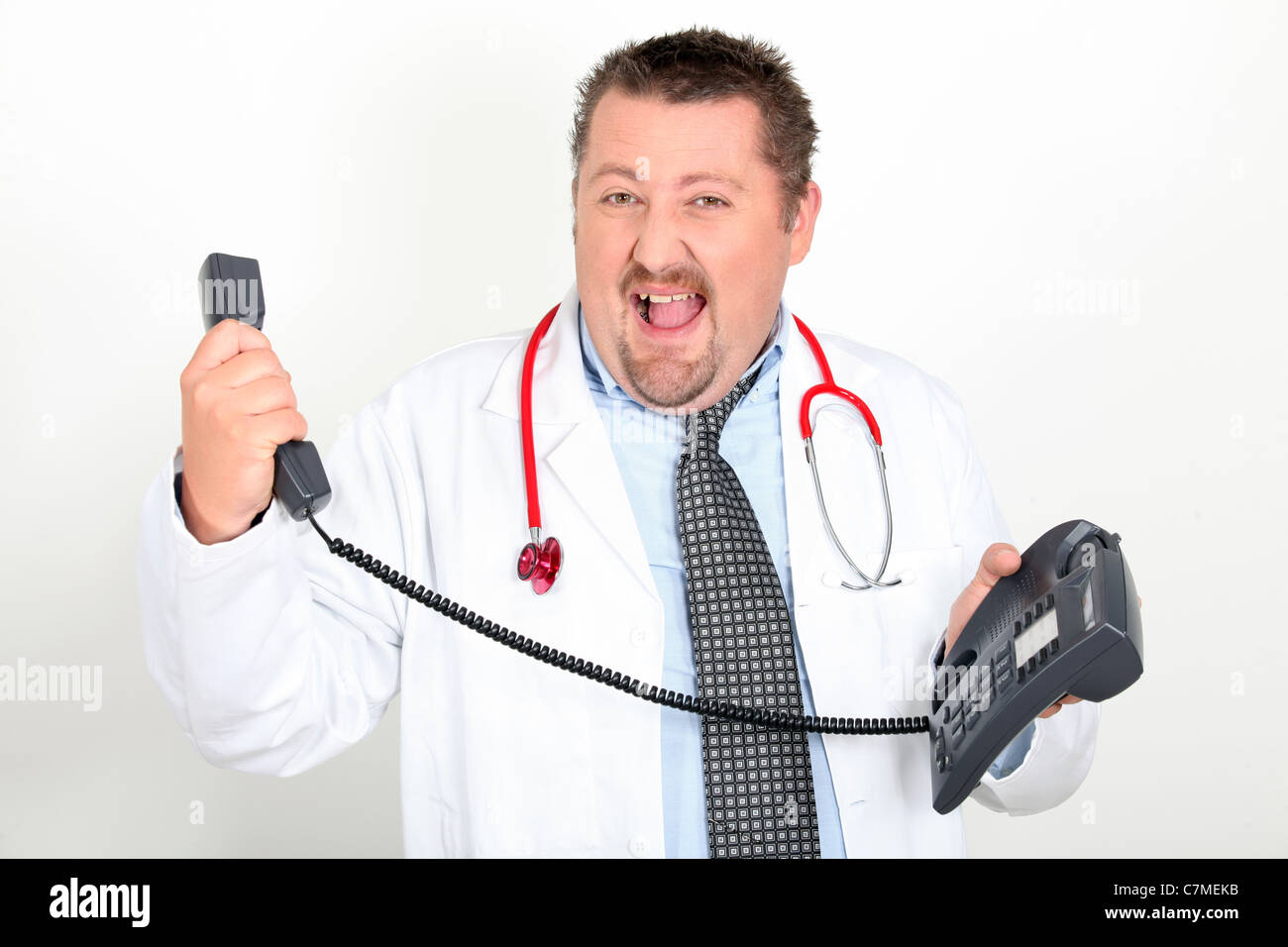 Doctor with a telephone Stock Photo - Alamy