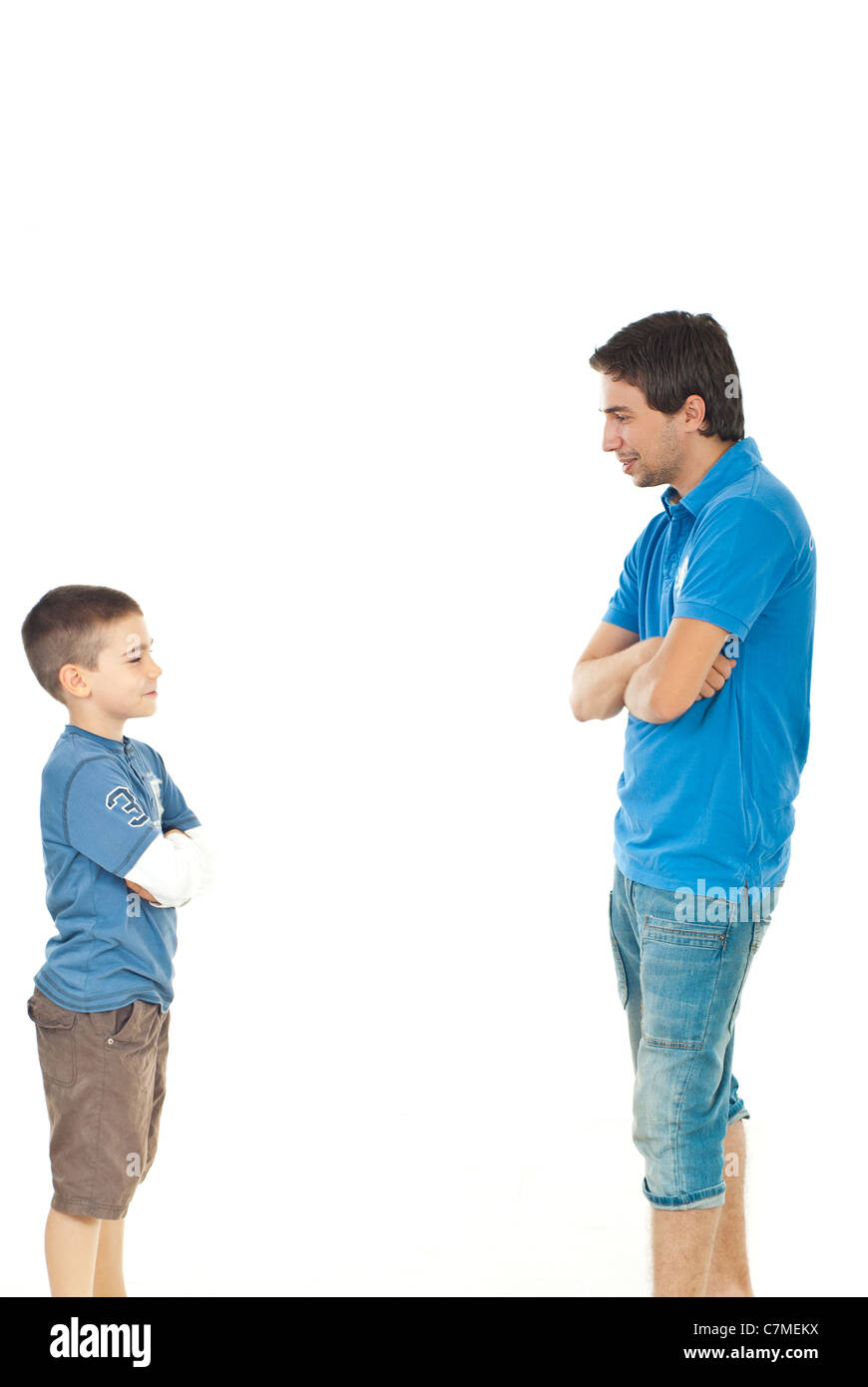 Father and son standing face to face and having conversation isolated ...