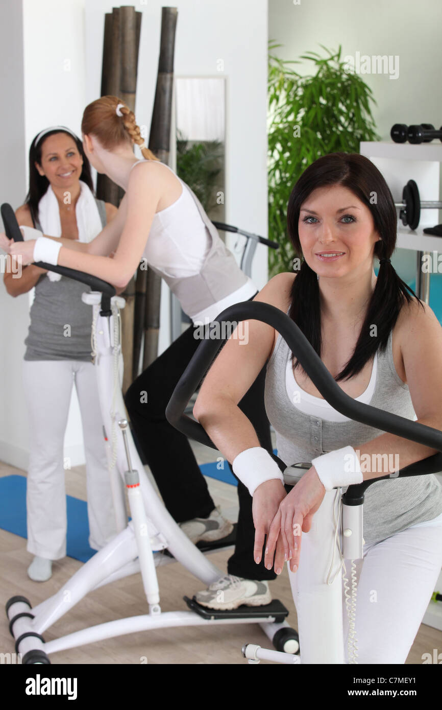 Women using gym equipment Stock Photo - Alamy