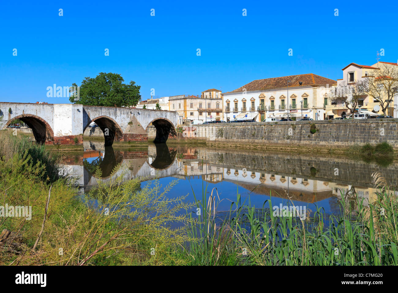 Silves Rio Arade waterfront and the Ponte Romana. Algarve, Portugal ...