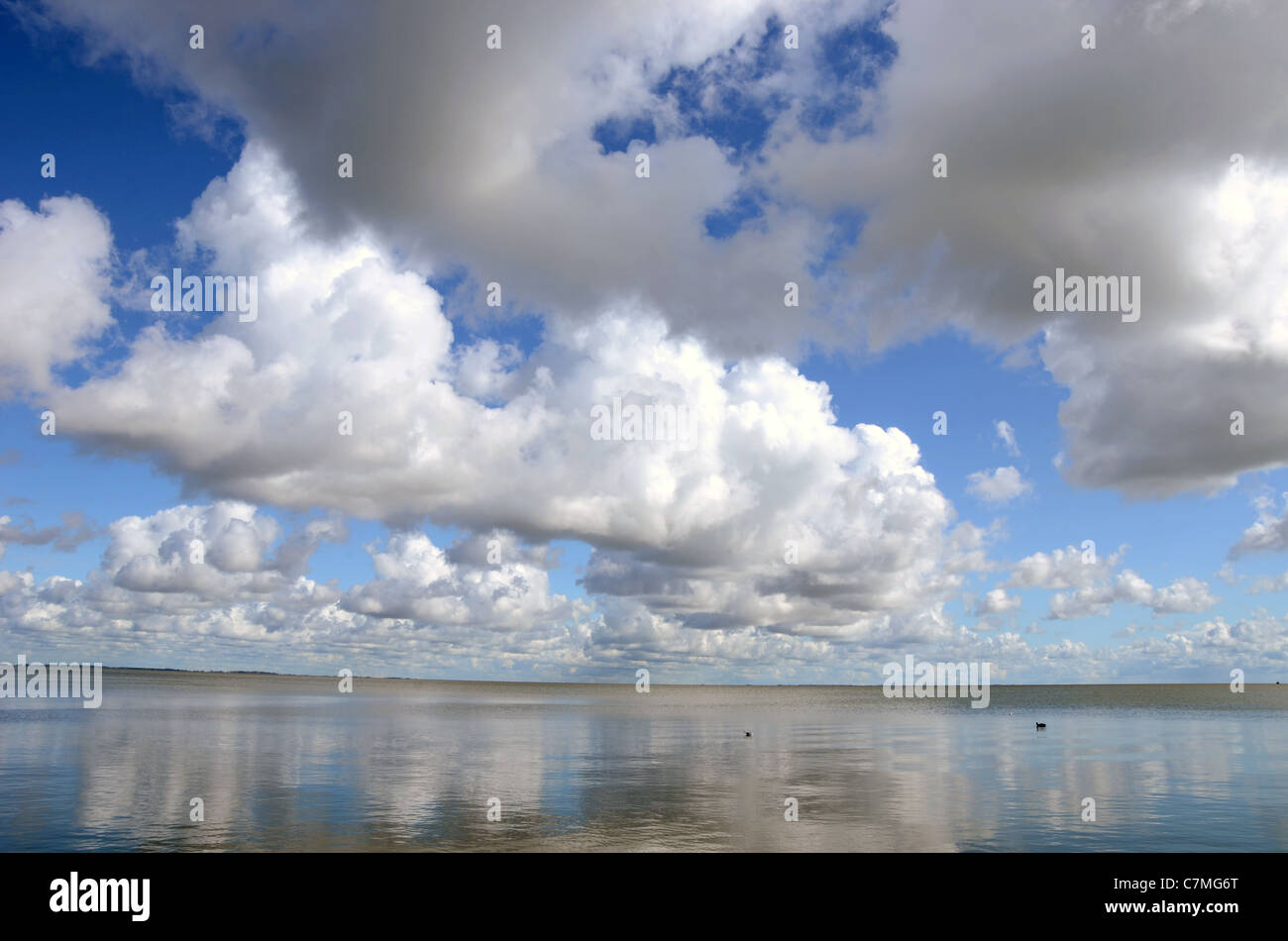summer end seascape with clouds reflections Stock Photo - Alamy