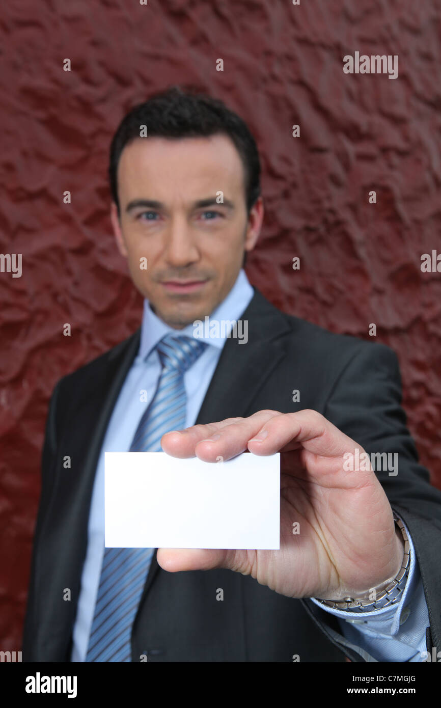 Business card man suit hand give hi-res stock photography and images ...