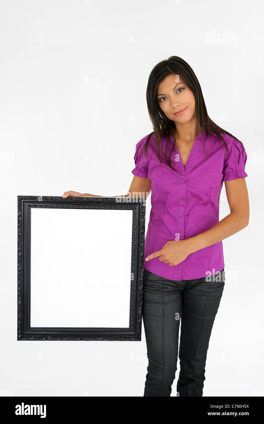 woman pointing at a picture frame Stock Photo - Alamy