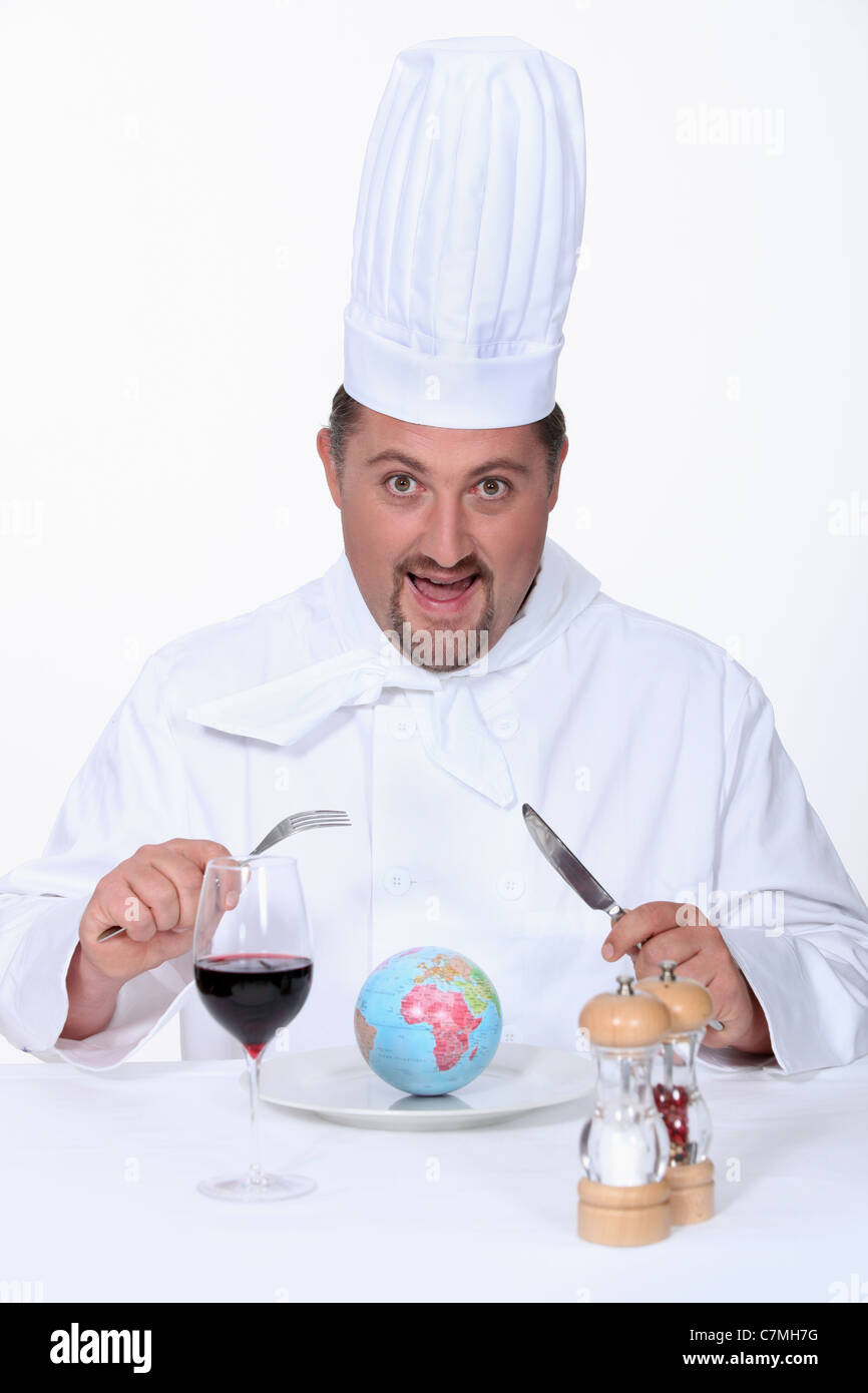 Chef eating planet earth Stock Photo - Alamy
