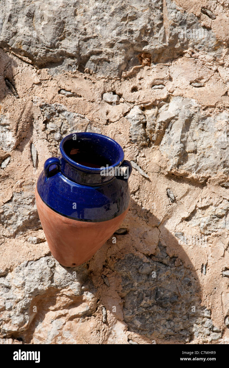 Ceramic pot on stone wall Stock Photo - Alamy