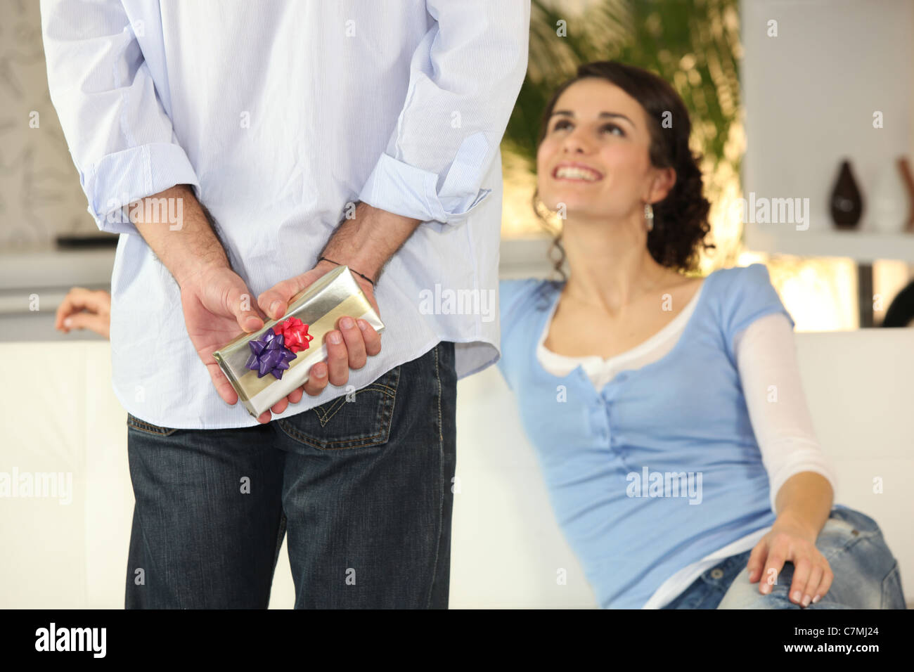 Man giving his girlfriend treat Stock Photo - Alamy