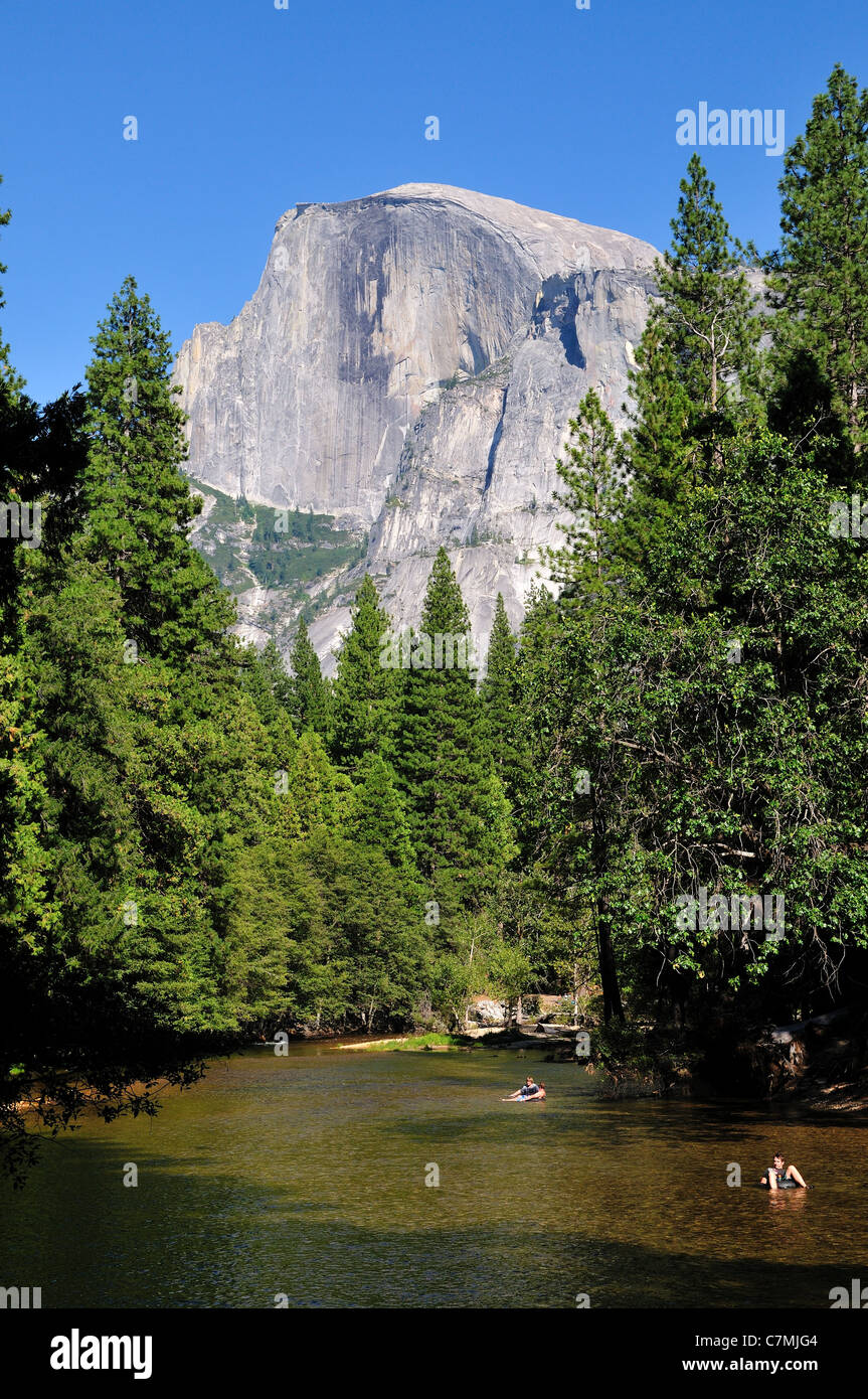 People tubing in the Merced River under Half Dome. Yosemite National ...