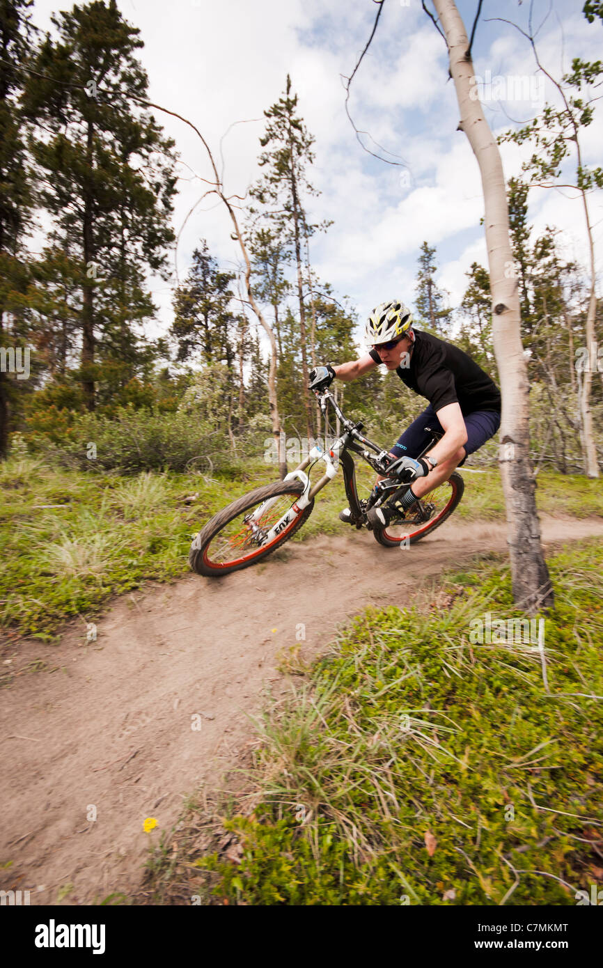 A mountain biker rides a trail in near Whitehorse, Yukon Territory ...