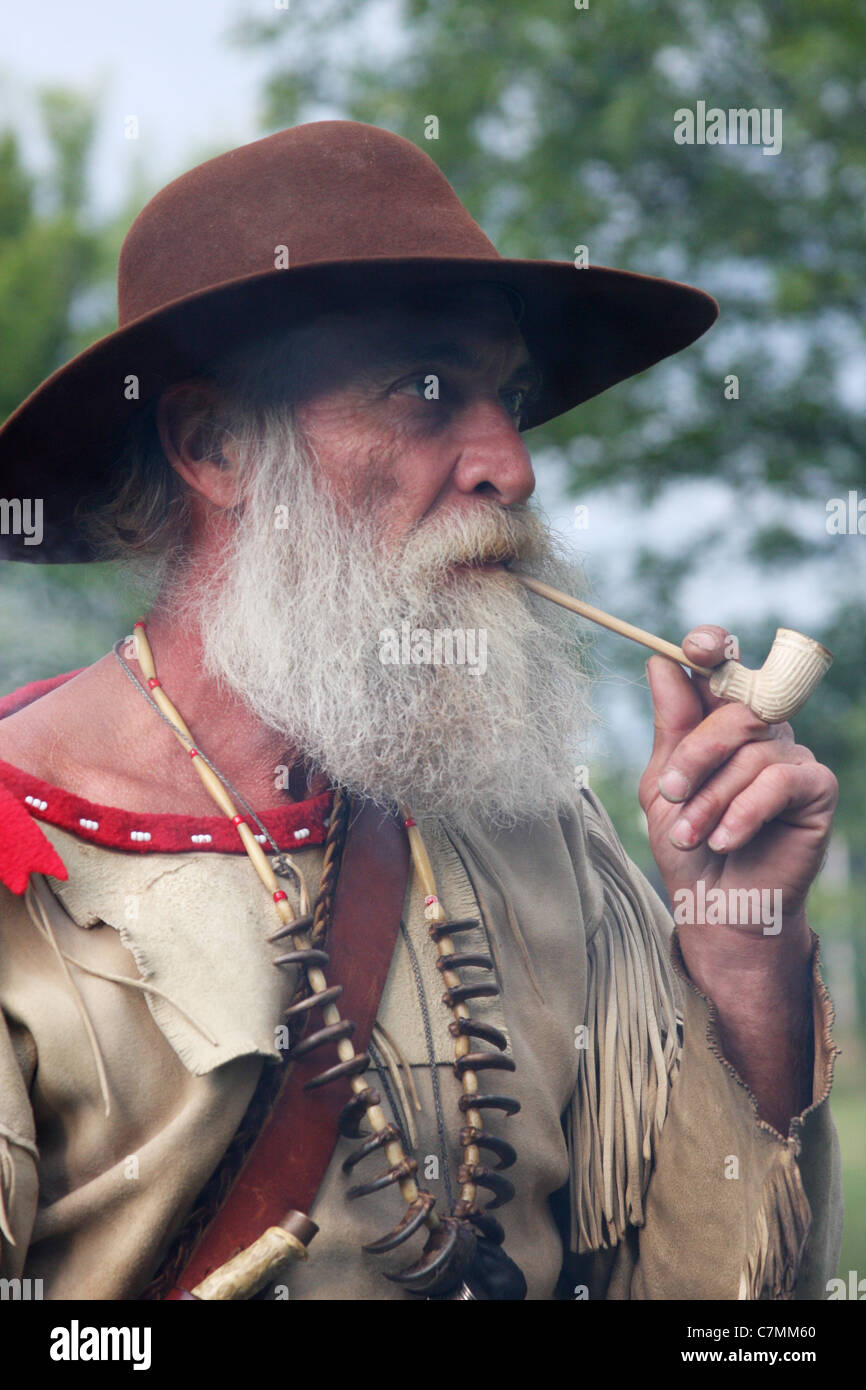 An early american trapper smoking a pipe Stock Photo - Alamy