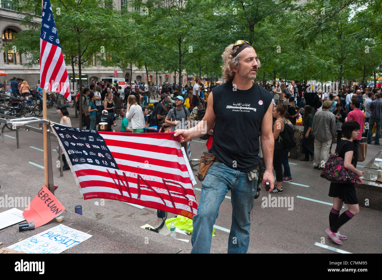 Occupation Wall Street protester with variation on the american flag ...