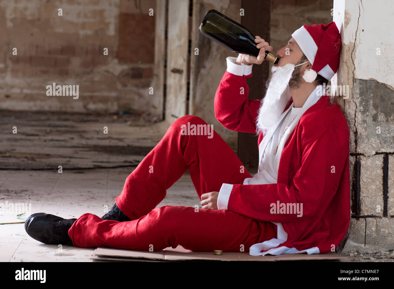 Alcoholic Santa Drinking a Wine Bottle Stock Photo - Alamy