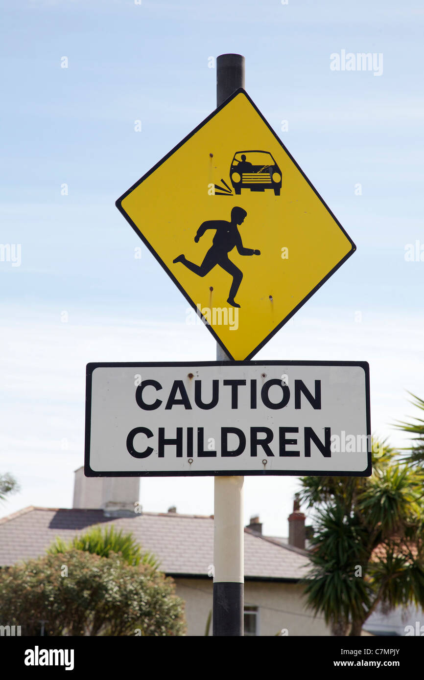 Caution children crossing Irish roadsign Stock Photo - Alamy