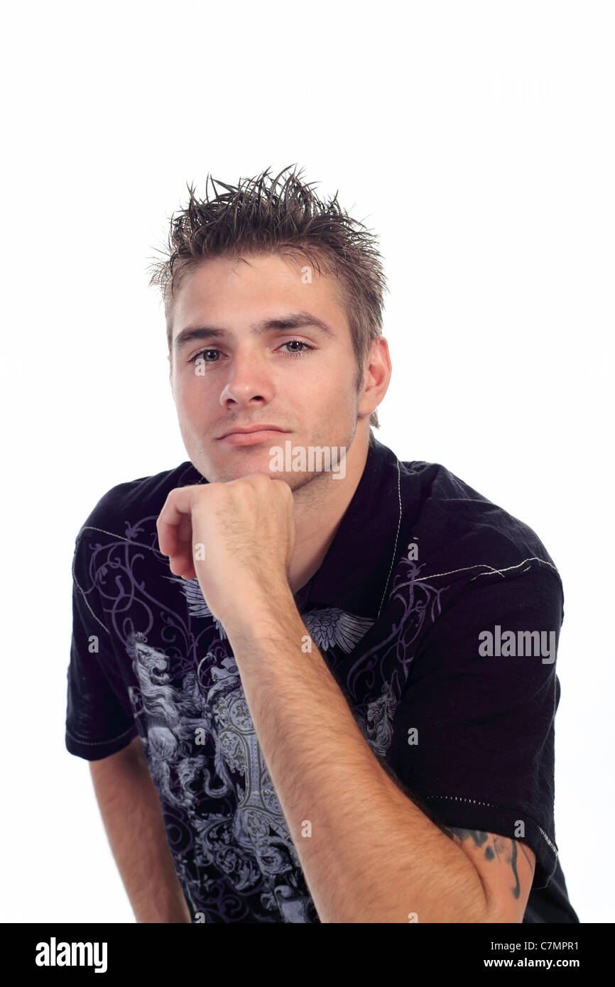 A young Caucasian male poses in studio over a white background Stock ...