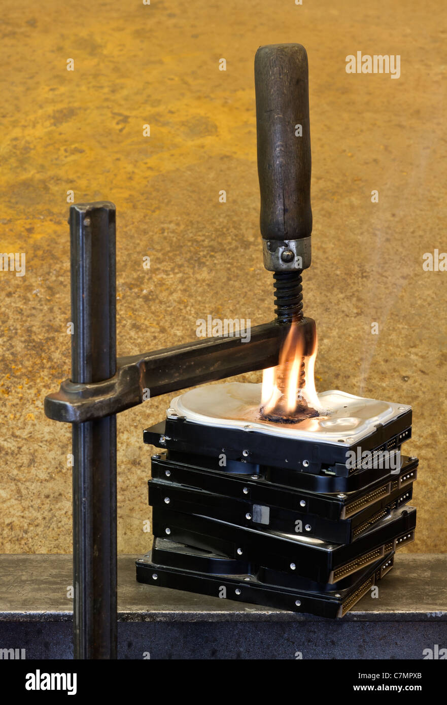 clamp pressing on burning stack of hard drives. Rusty Background Stock ...