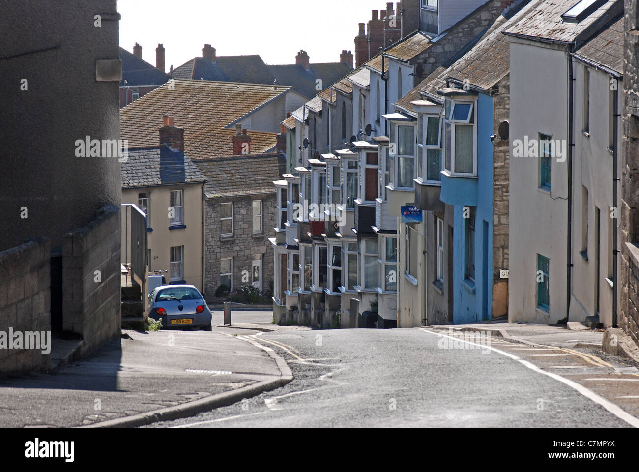 Looking down High Street showing a terrace of houses with repeating bow ...