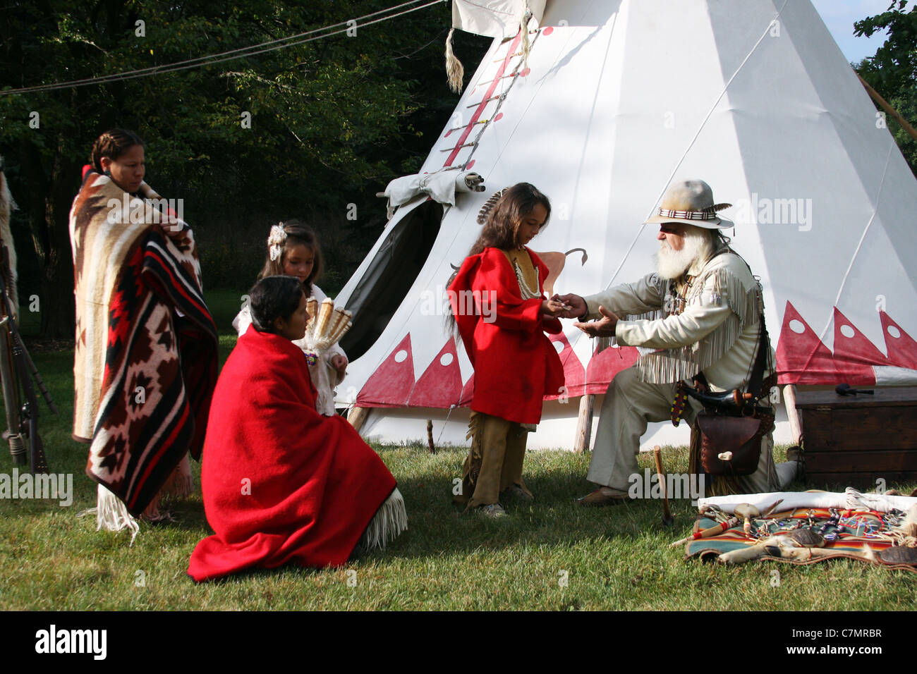 Native American Indian boy trading for a knife with a mountainman Stock ...