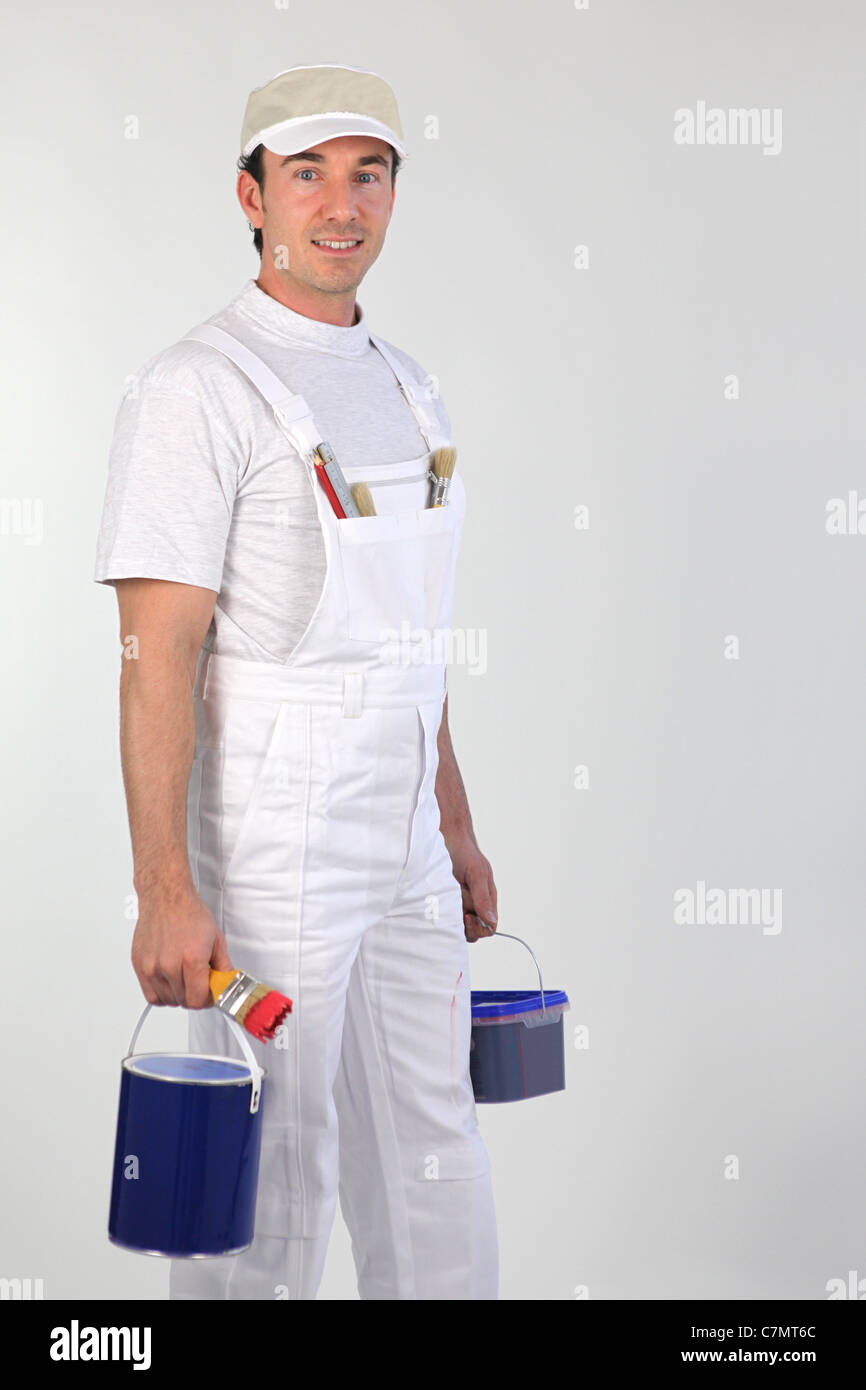 Male painter carrying paint pots Stock Photo - Alamy