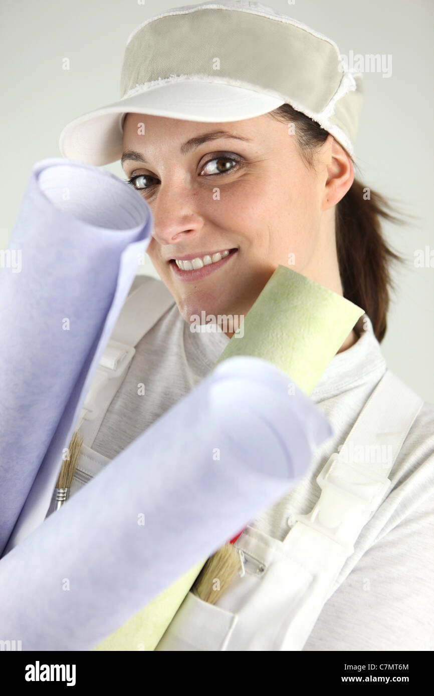 Decorator with rolls of wallpaper Stock Photo - Alamy