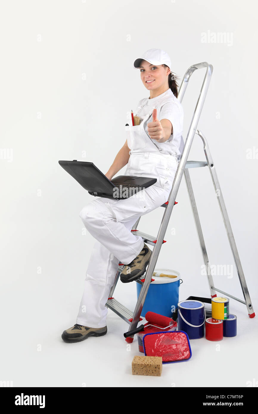 Decorator with a laptop Stock Photo - Alamy