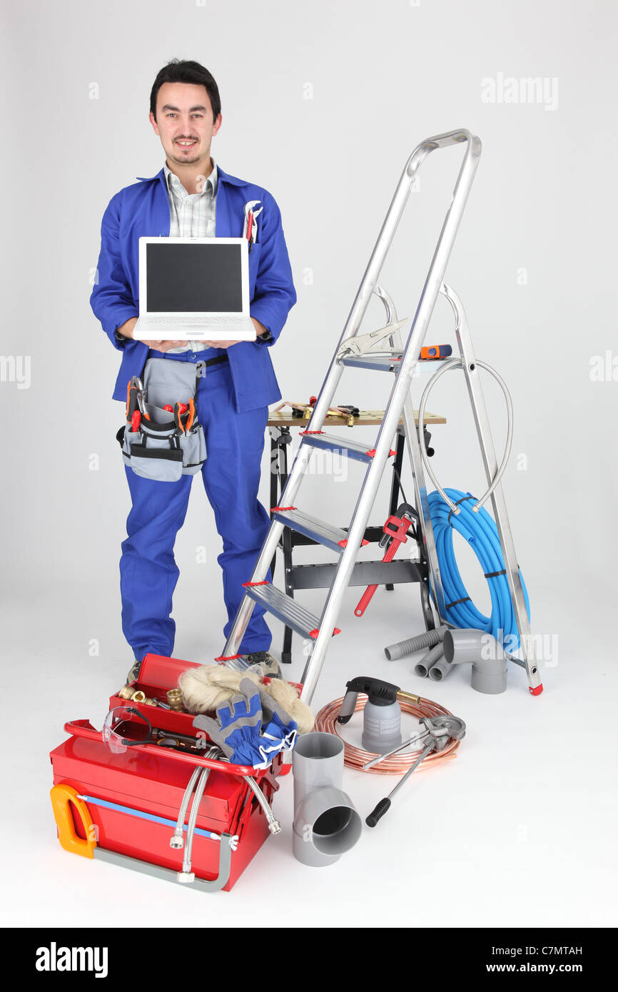 plumber showing computer Stock Photo - Alamy