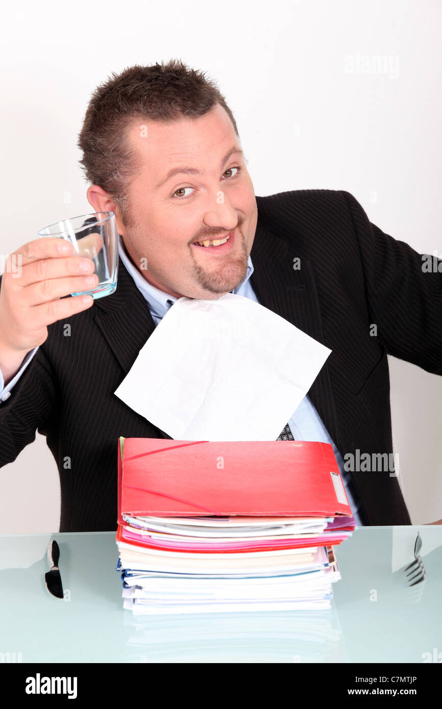 Man eating paperwork Stock Photo - Alamy