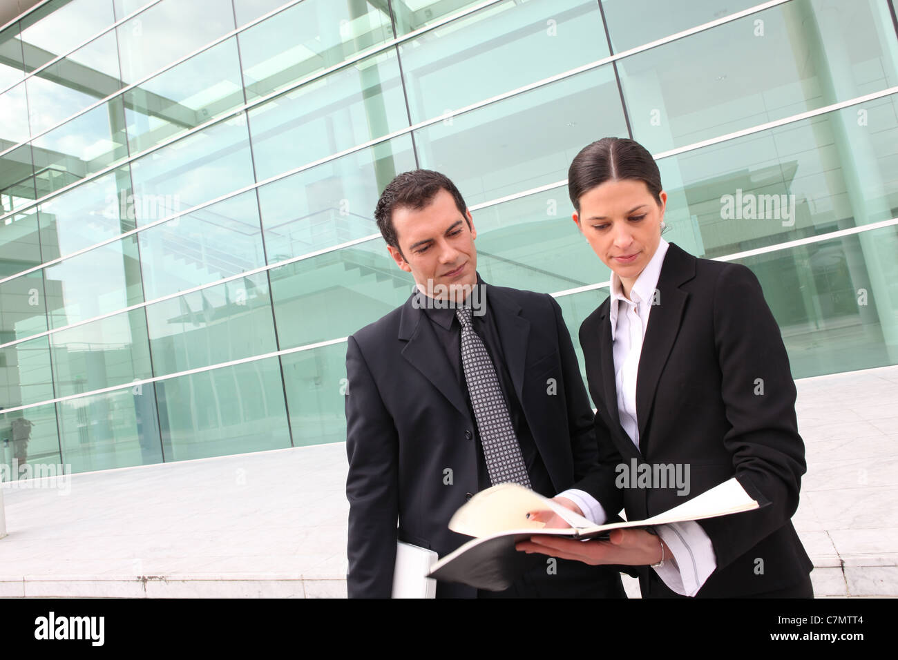colleagues working behind a building Stock Photo - Alamy