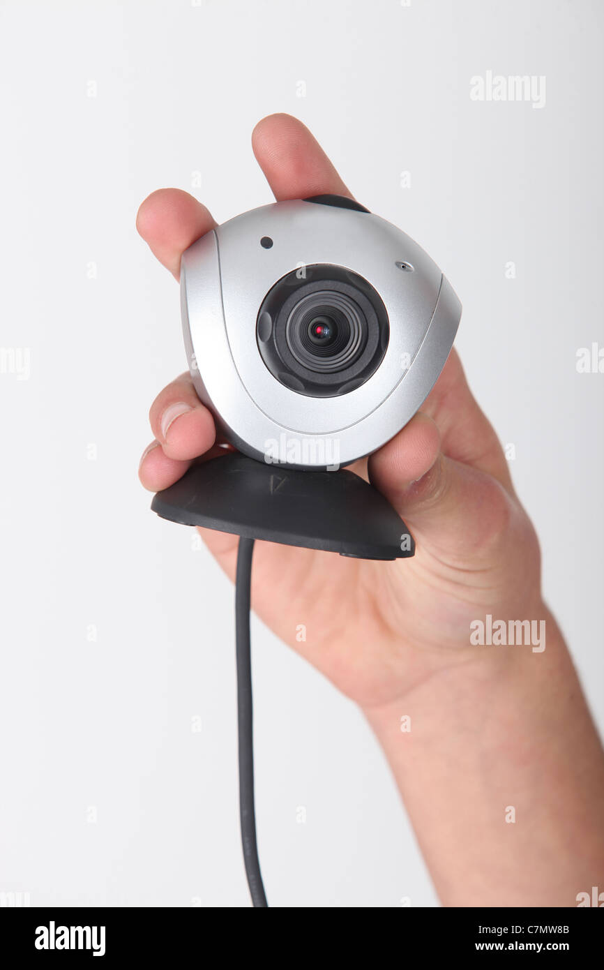 Hand holding a webcam Stock Photo - Alamy