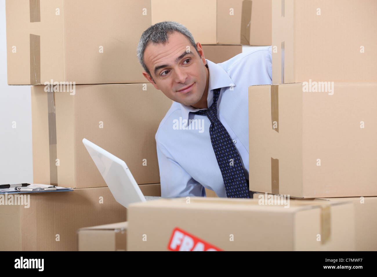 Man in warehouse Stock Photo - Alamy