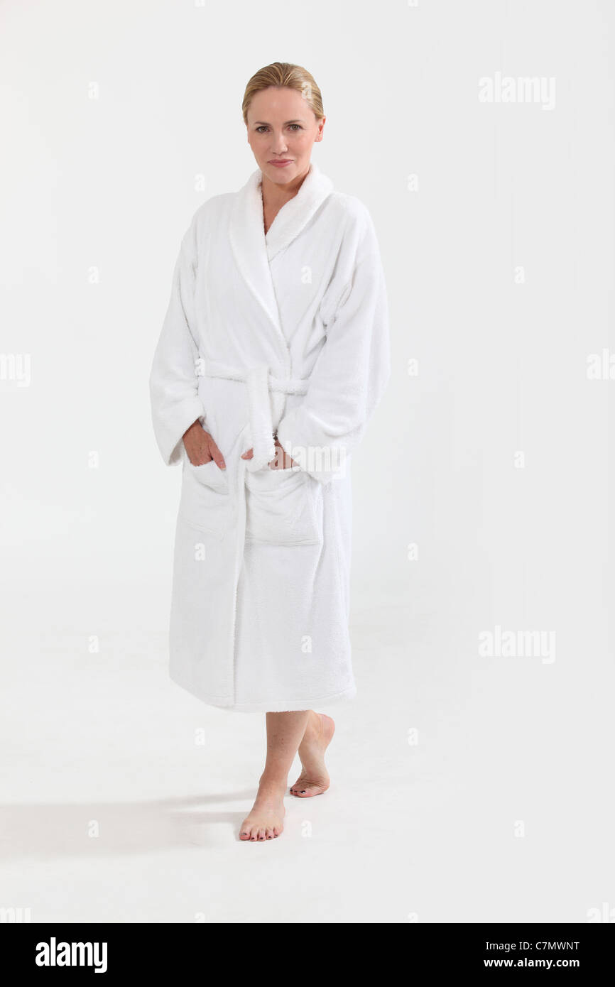 Woman in bath robe with hands in pockets Stock Photo - Alamy