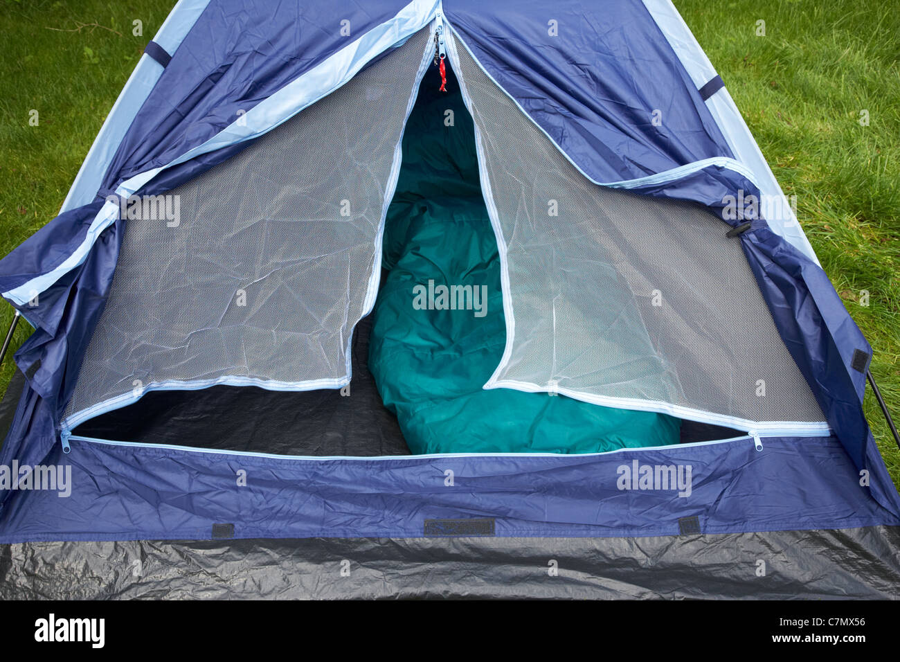 front door left open on a small dome tent Stock Photo - Alamy