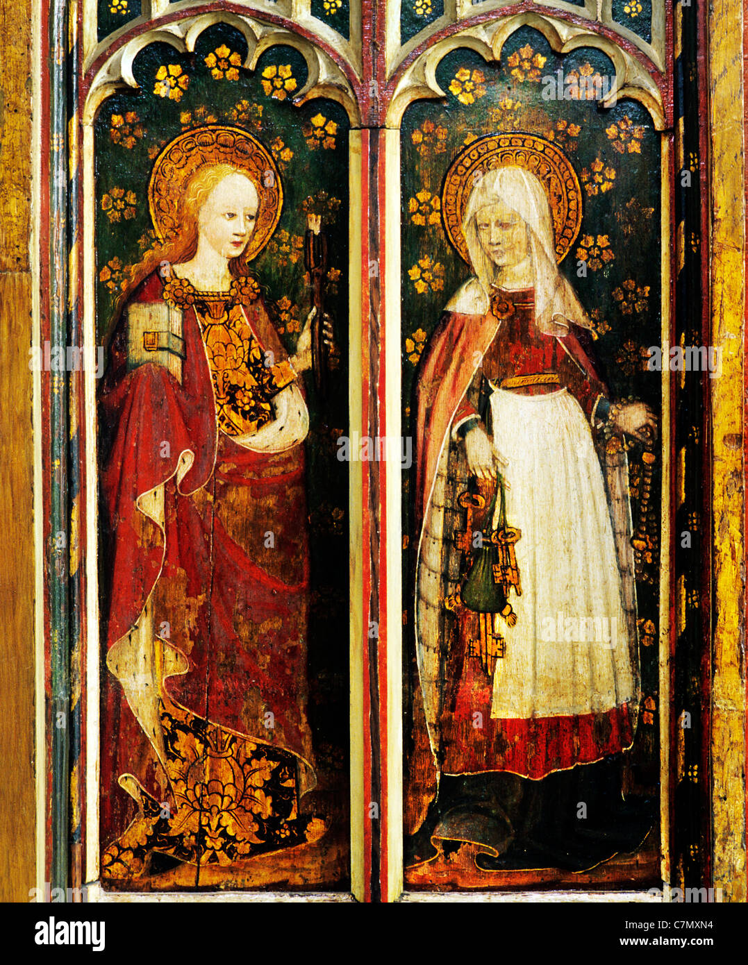 Barton Turf, Norfolk, rood screen, St. Apollonia, holding a pair of ...