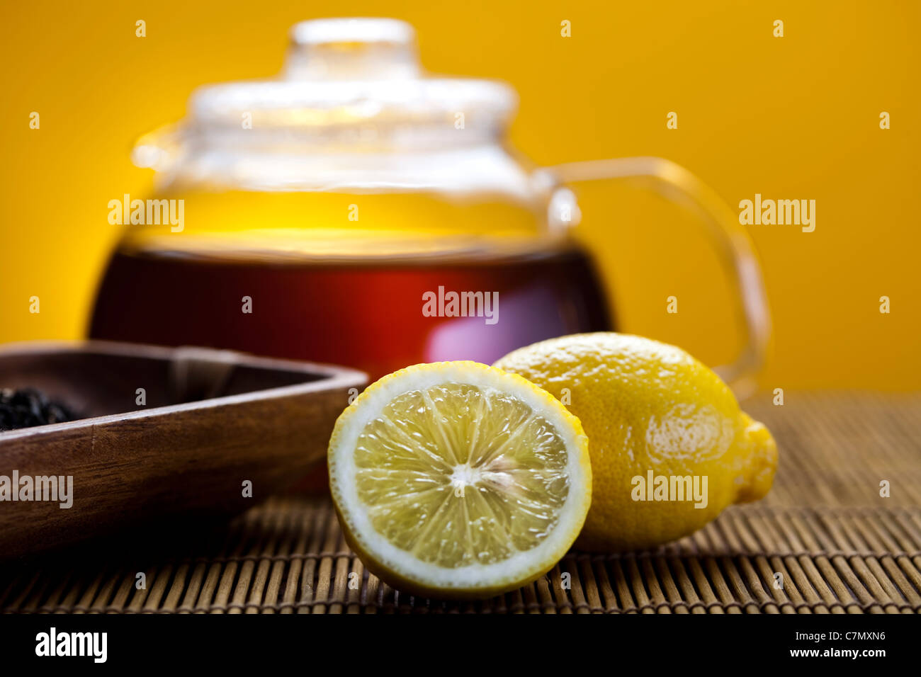 Glass teapot of tea with lemon Stock Photo - Alamy