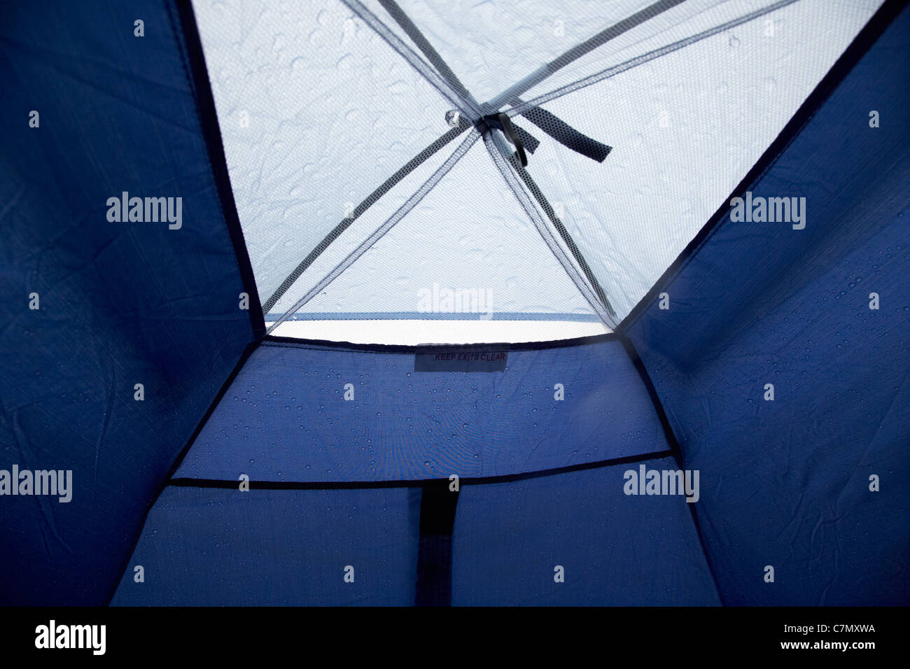 inside a rain soaked small tent looking up at roof vent Stock Photo - Alamy