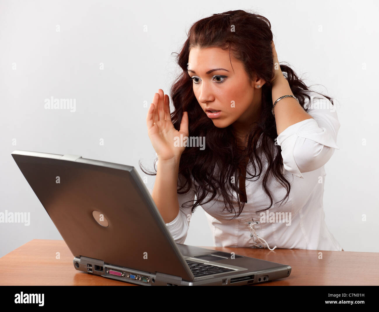 Young woman surfing the Internet on a laptop Stock Photo - Alamy