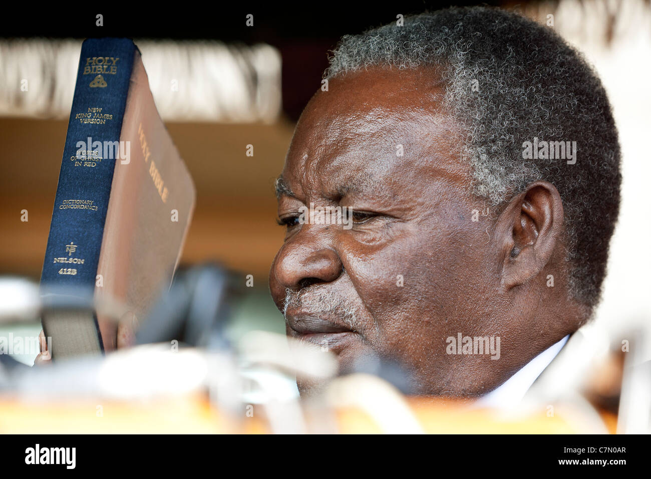 Newly-elected President Sata holds a Bible as he is sworn into office ...