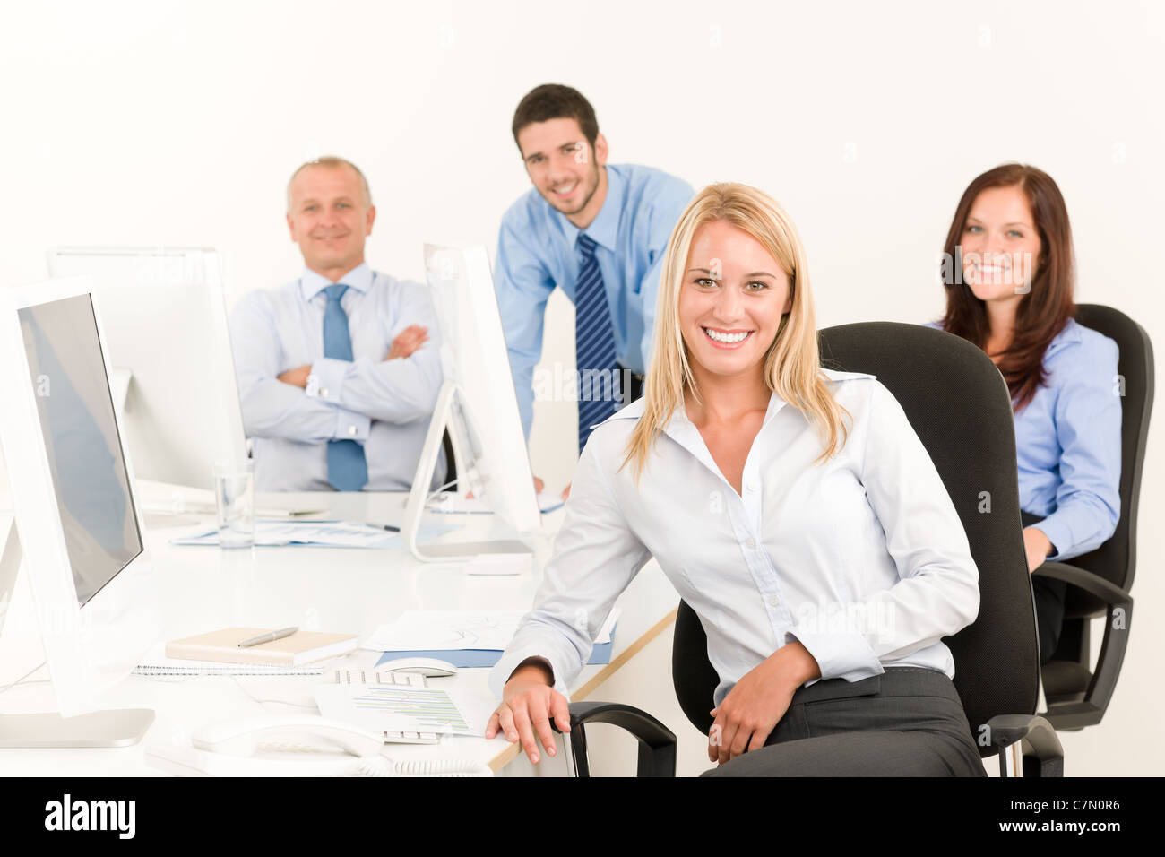 Business team pretty smiling businesswoman portrait happy colleagues ...