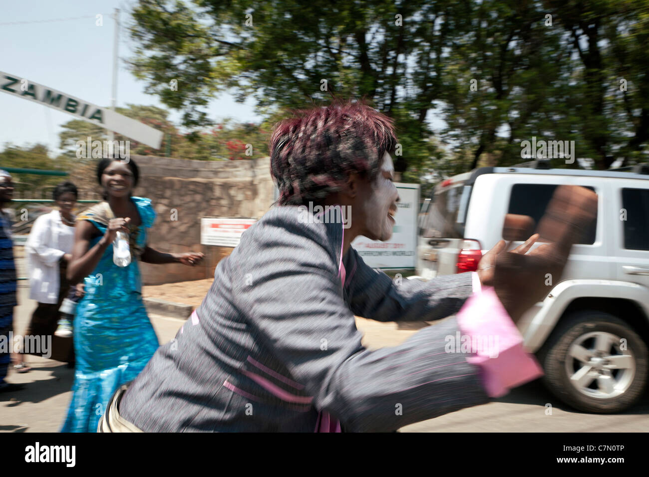 A jubilant supporter of the Opposition PF party and its newly elected ...